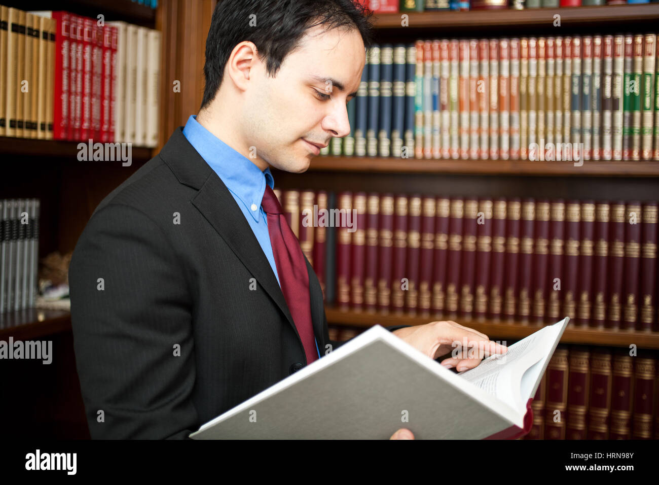 Successful lawyer portrait in his studio Stock Photo - Alamy