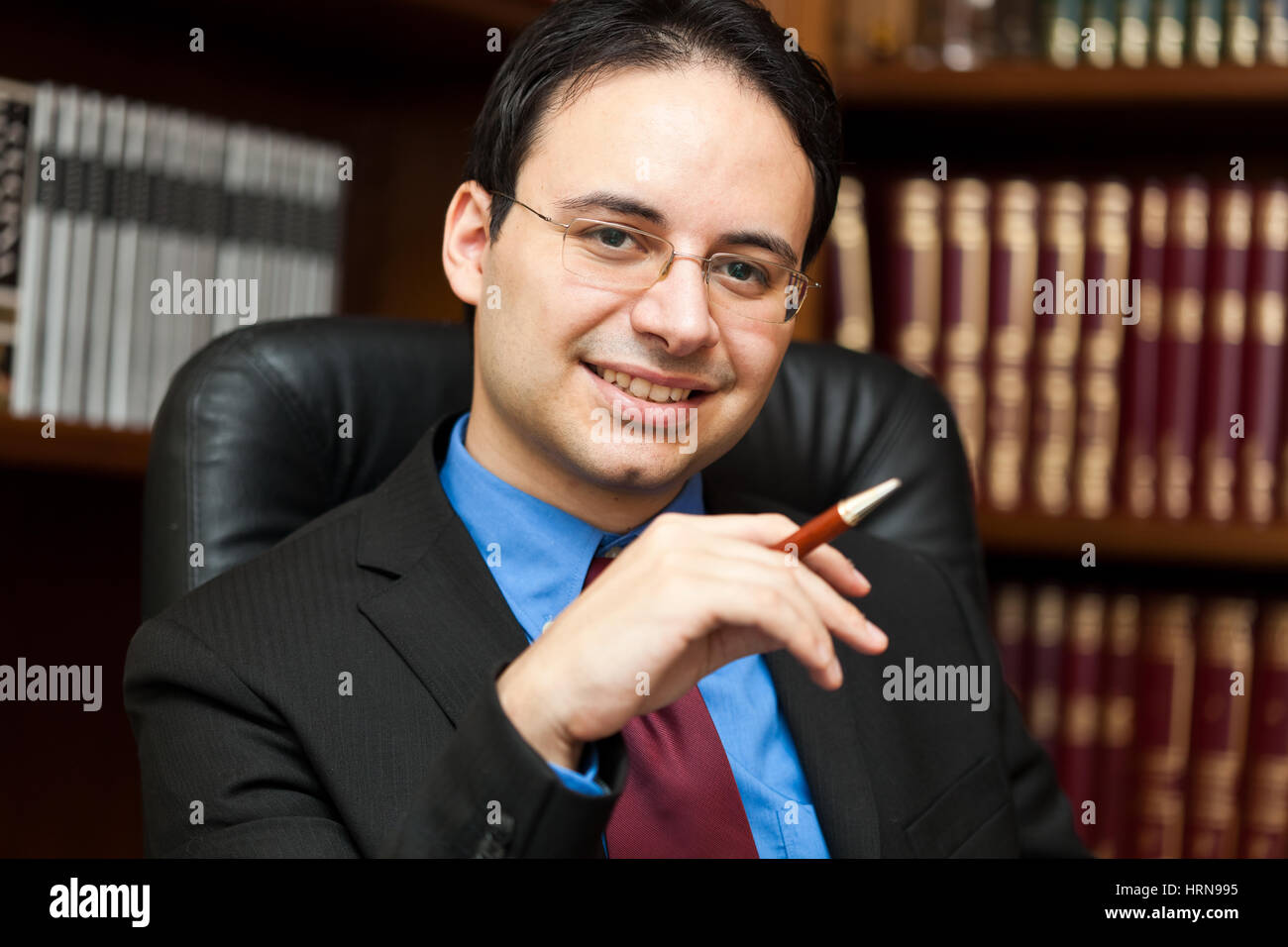 Handsome successful lawyer portrait in his studio Stock Photo - Alamy