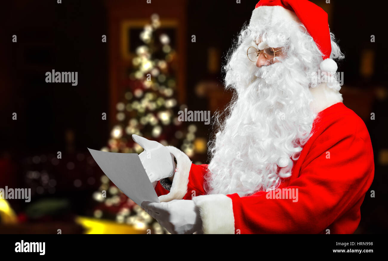 Santa reading a letter hi-res stock photography and images - Alamy