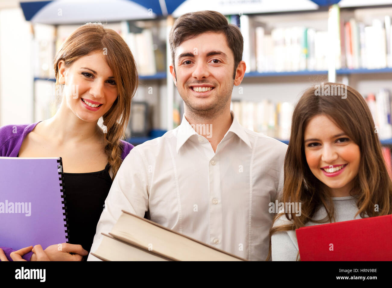 Group of Students at work in a Library Stock Photo - Alamy
