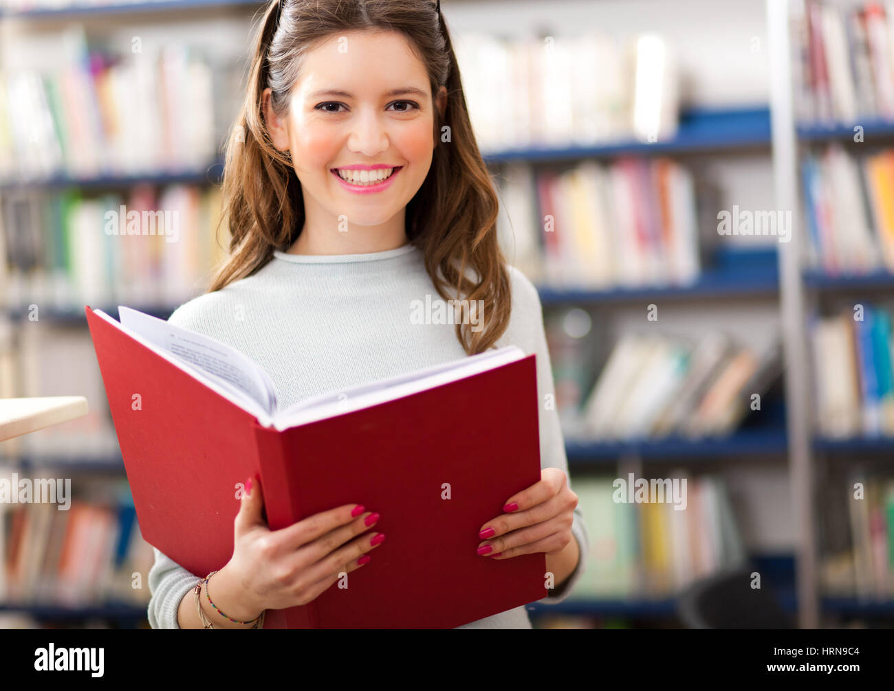 Portrait of a Student in a Library Stock Photo - Alamy
