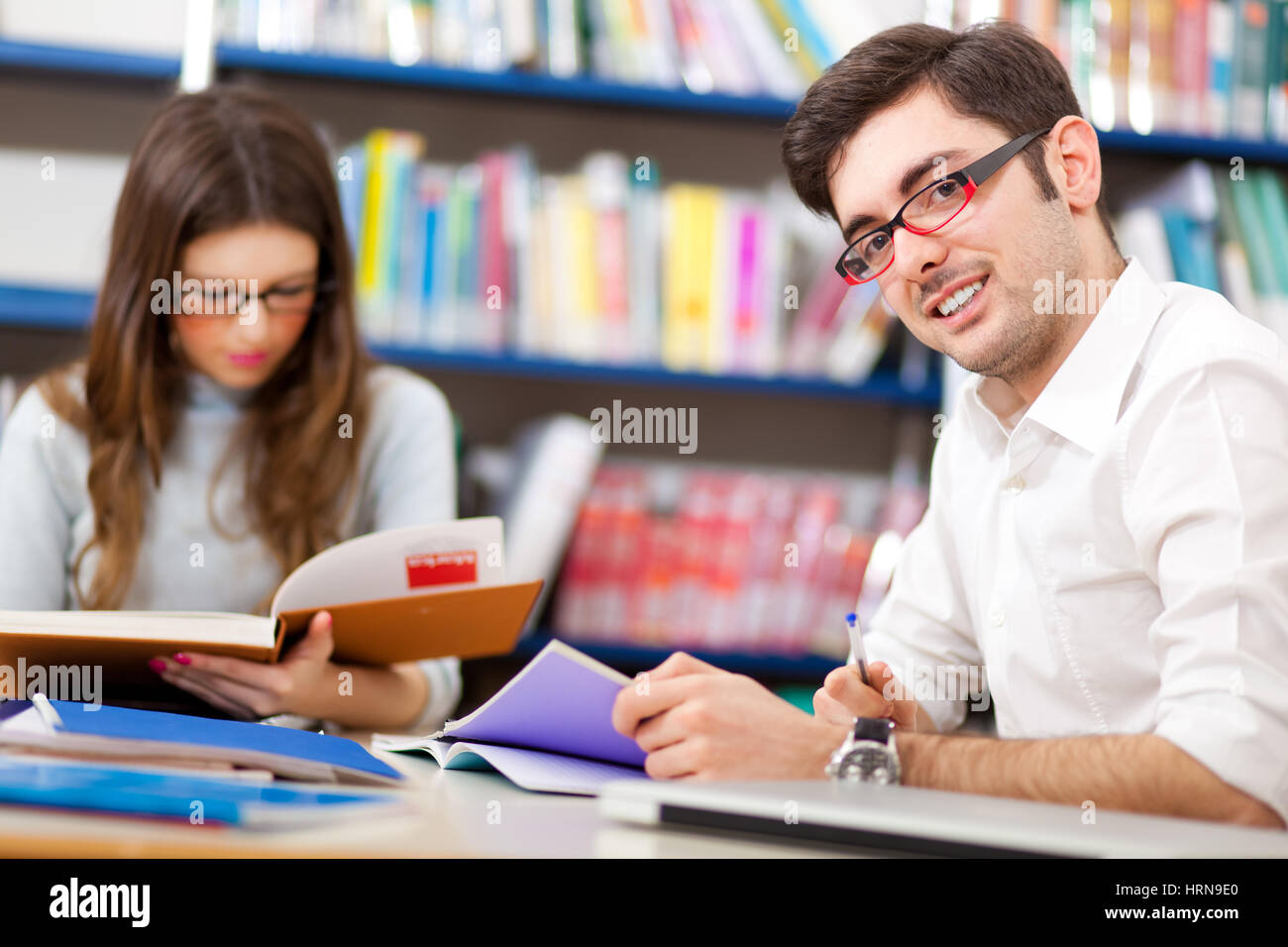 Group of Students at work in a Library Stock Photo - Alamy