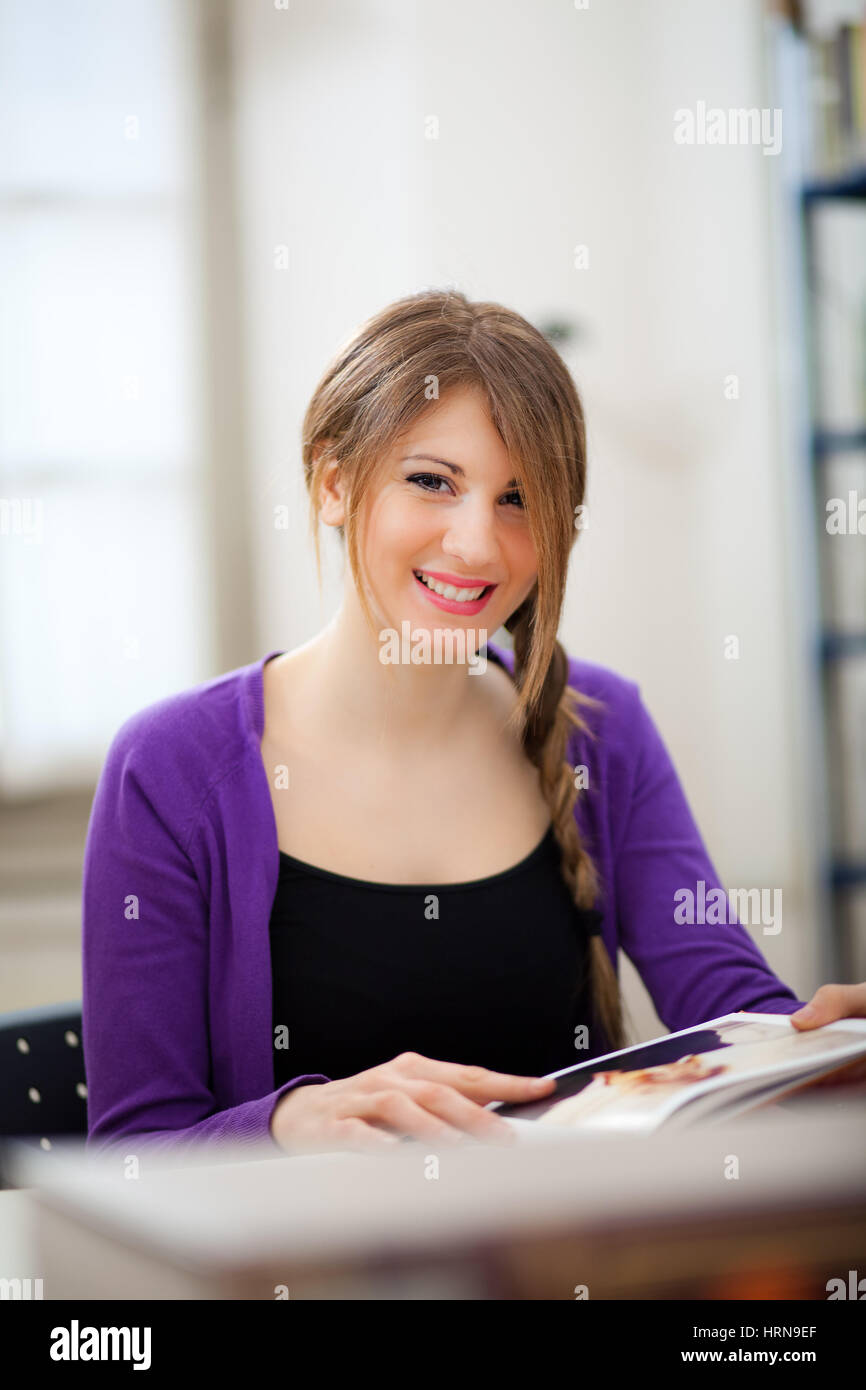 Female student read textbook in hi-res stock photography and images - Alamy