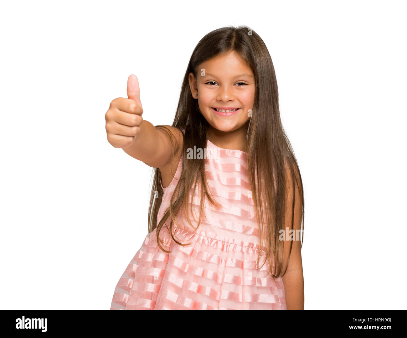 Little smiling girl making ok sign isolated Stock Photo - Alamy