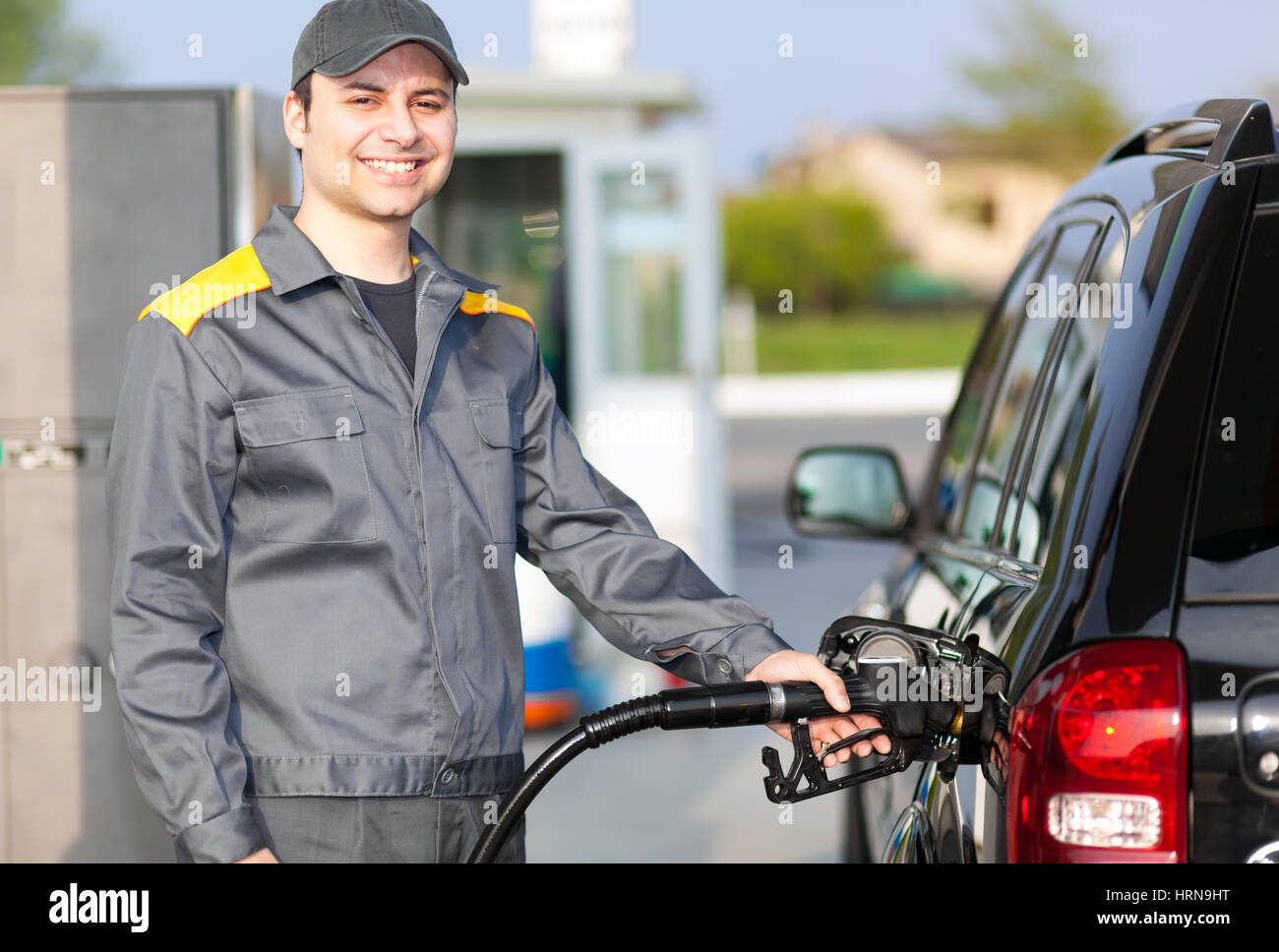Man working at the gas station Stock Photo - Alamy