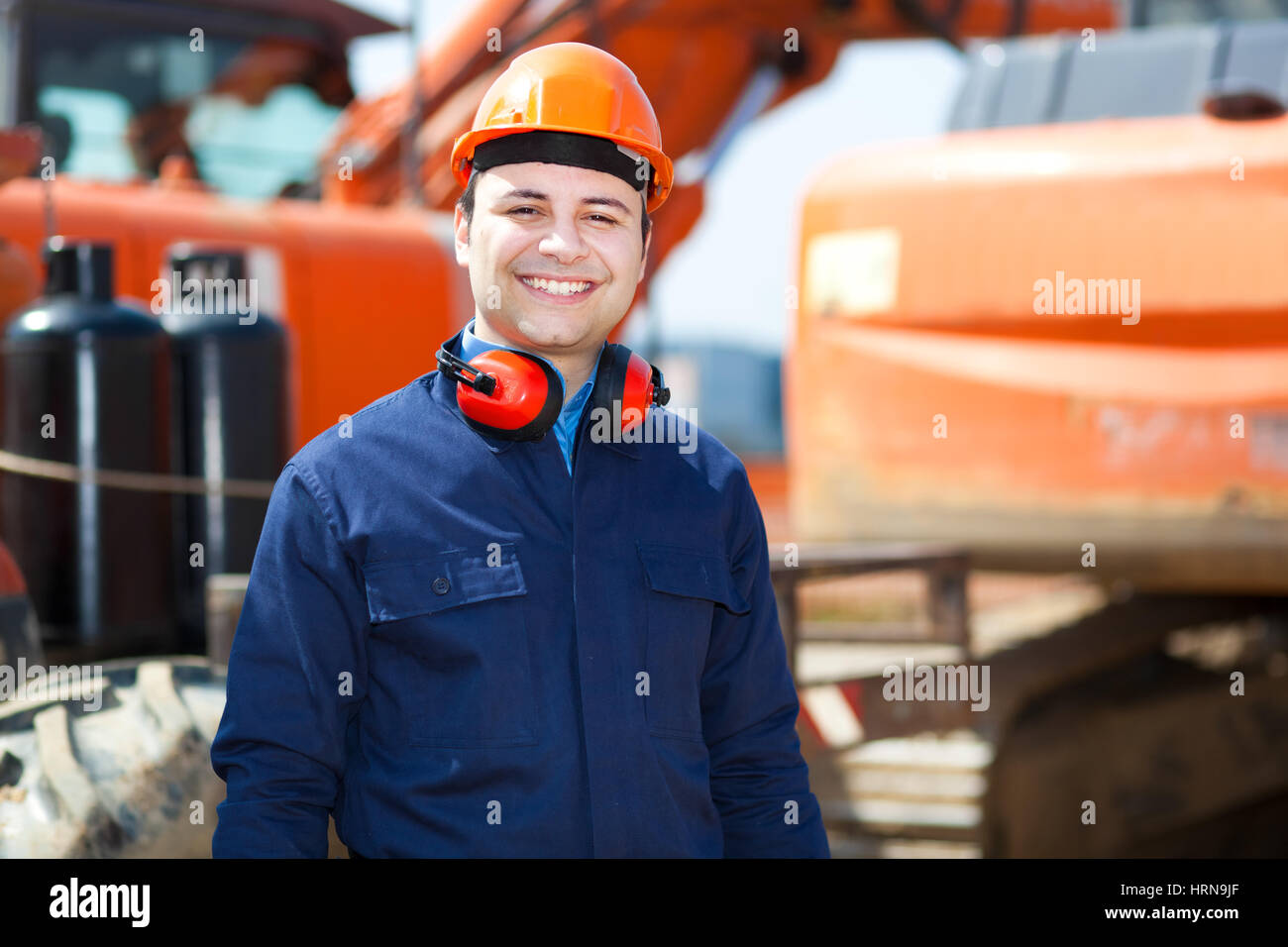 Man at work in a construction site Stock Photo - Alamy