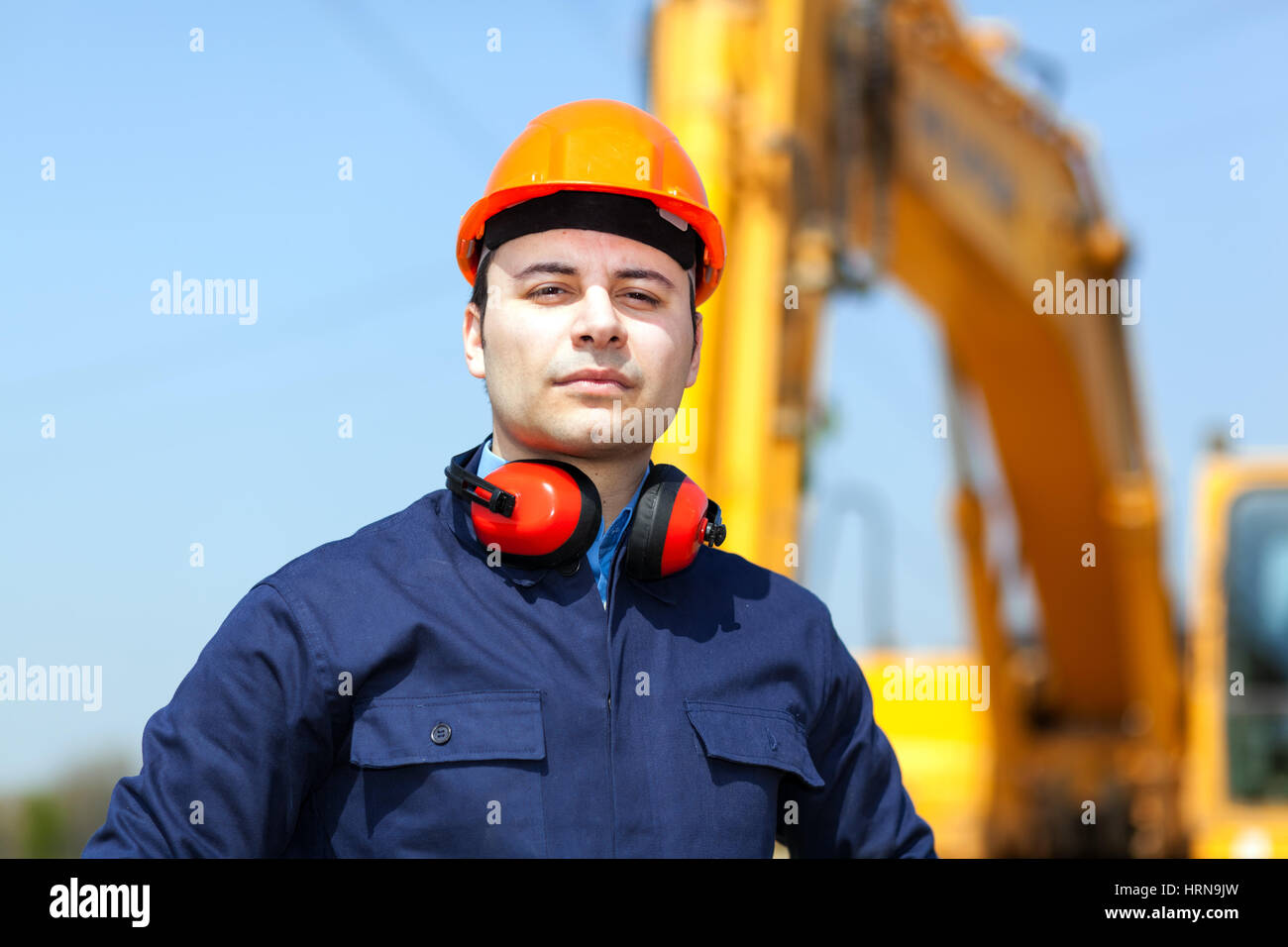 Man at work in a construction site Stock Photo - Alamy