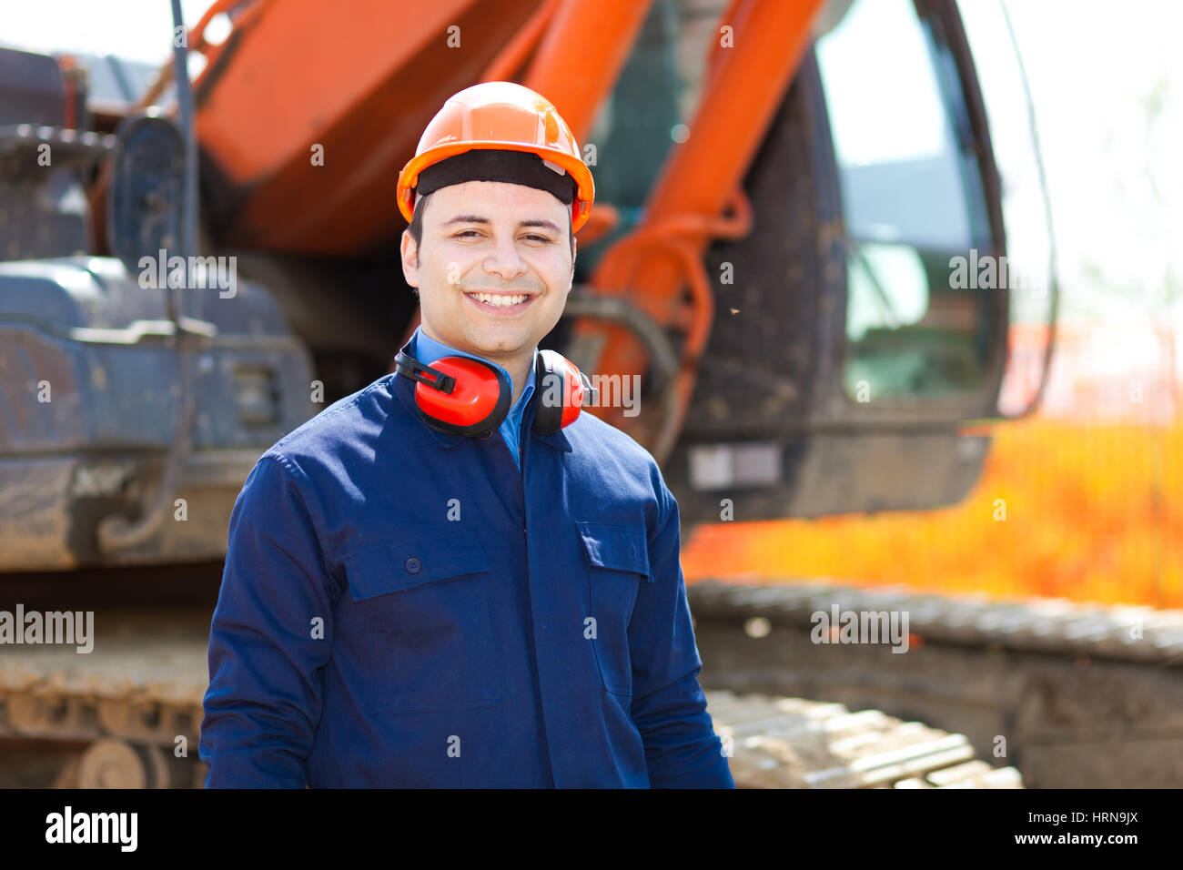 Man at work in a construction site Stock Photo - Alamy