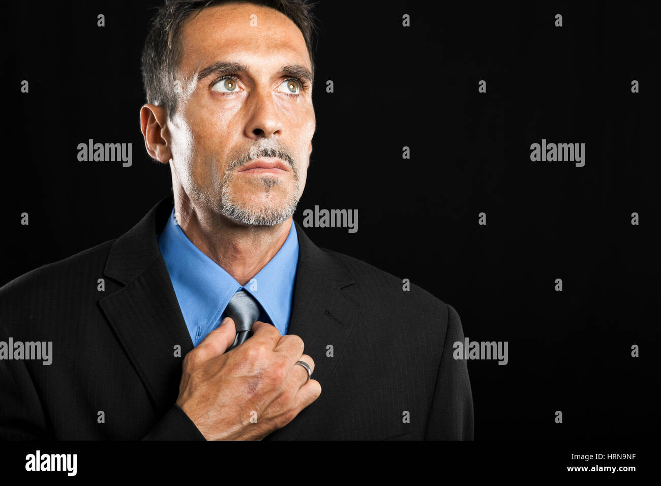 Businessman adjusting his collar Stock Photo - Alamy