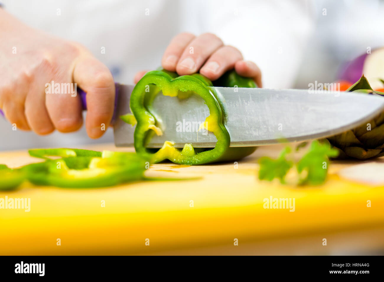 Chef cutting vegetables in his kitchen Stock Photo - Alamy