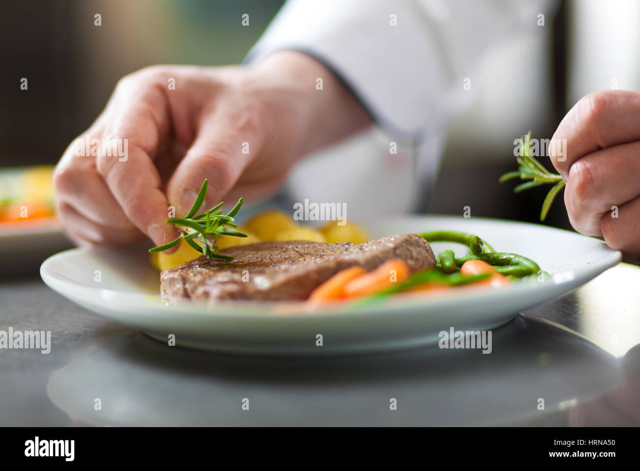 Detail of a Chef at work in his Kitchen Stock Photo - Alamy