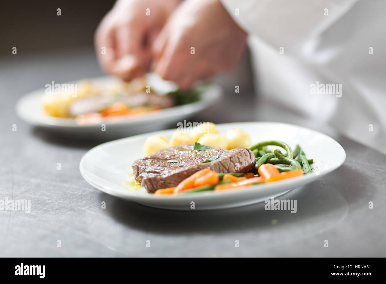 Detail of a Chef at work in his Kitchen Stock Photo - Alamy