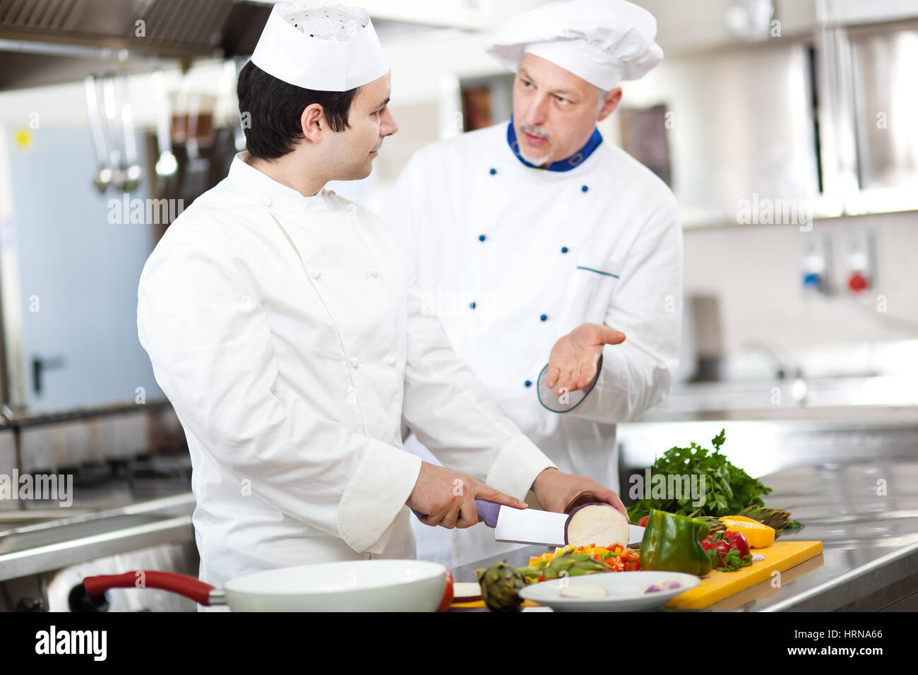 Detail of a Chef at work in his Kitchen Stock Photo - Alamy