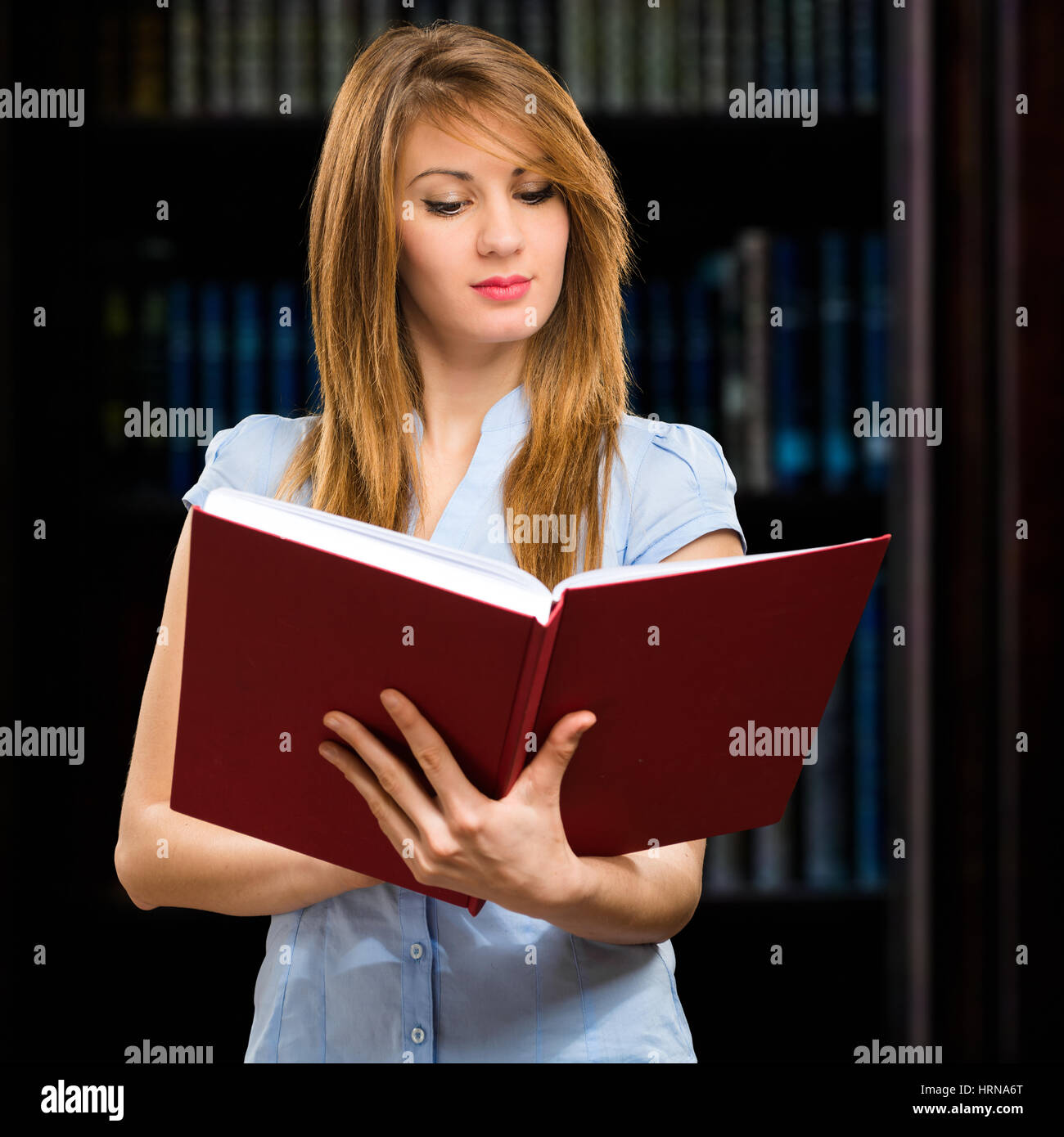 Portrait of a woman reading a book Stock Photo - Alamy
