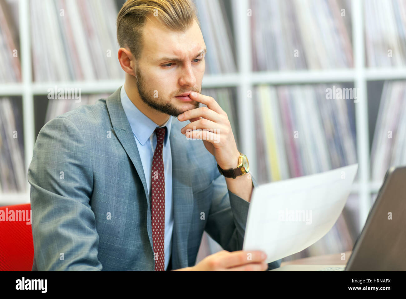 Portrait of a businessman reading a document Stock Photo - Alamy