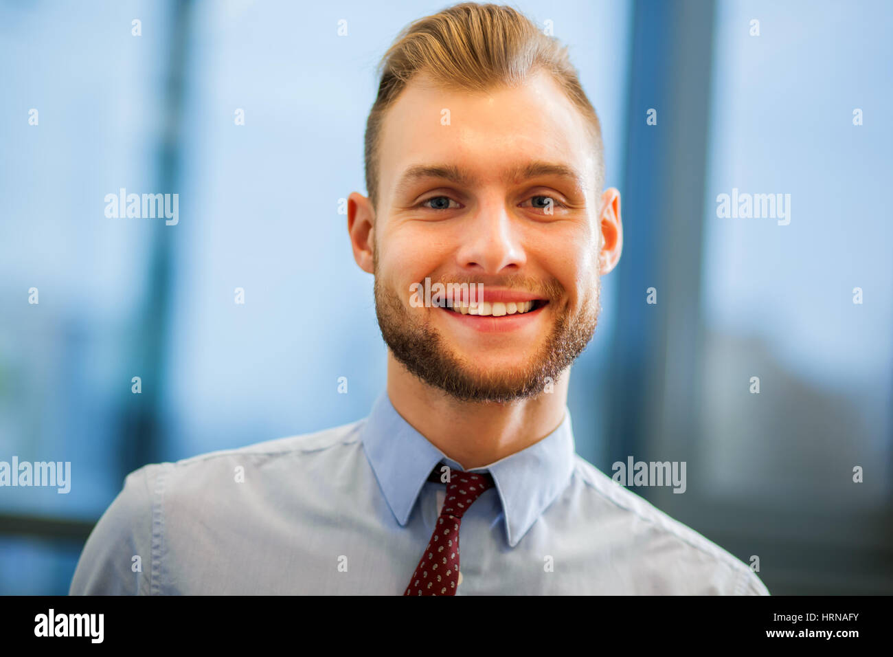 Portrait of a friendly businessman in his office Stock Photo - Alamy