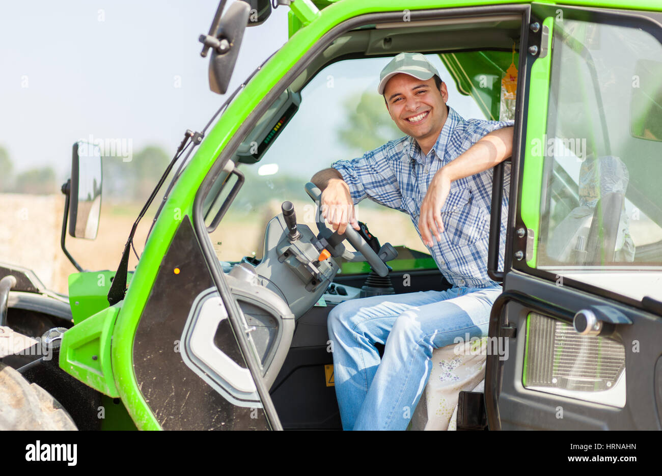 Farmer in the tractor hi-res stock photography and images - Alamy