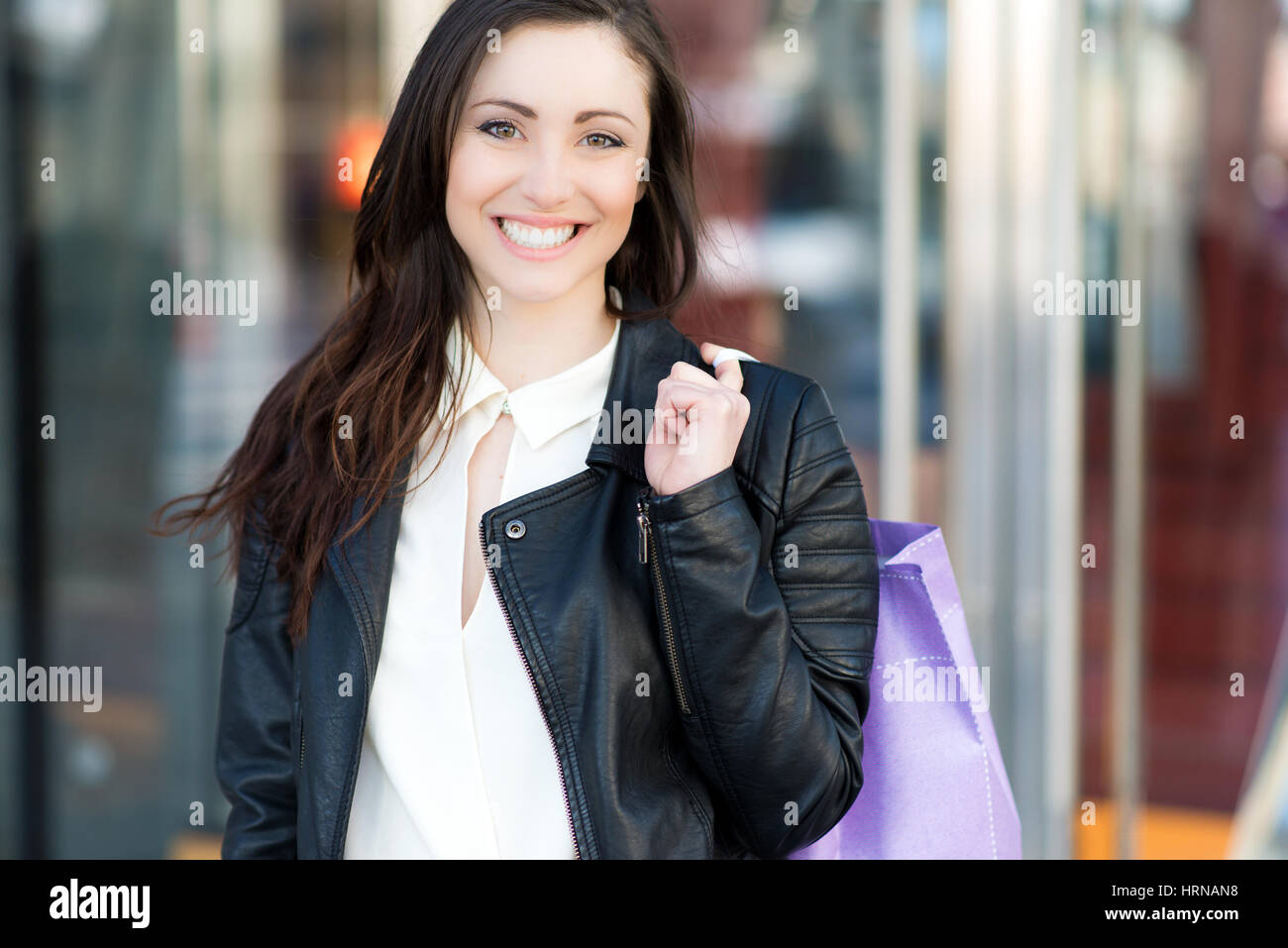 Young woman shopping outdoor Stock Photo - Alamy