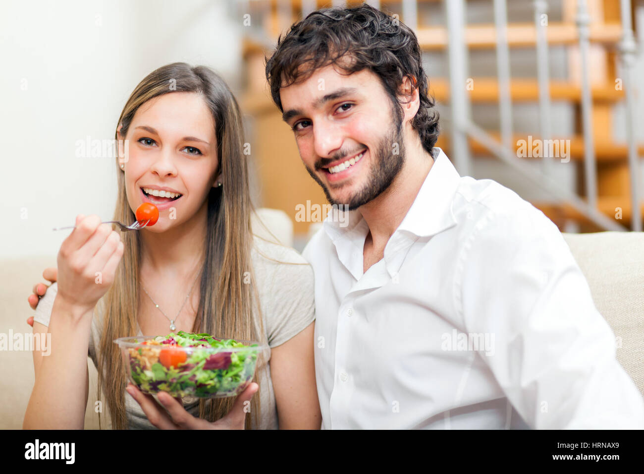 Man eating salad sofa hi-res stock photography and images - Alamy