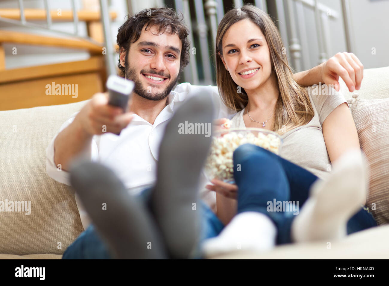 Couple watching a movie in their house Stock Photo - Alamy