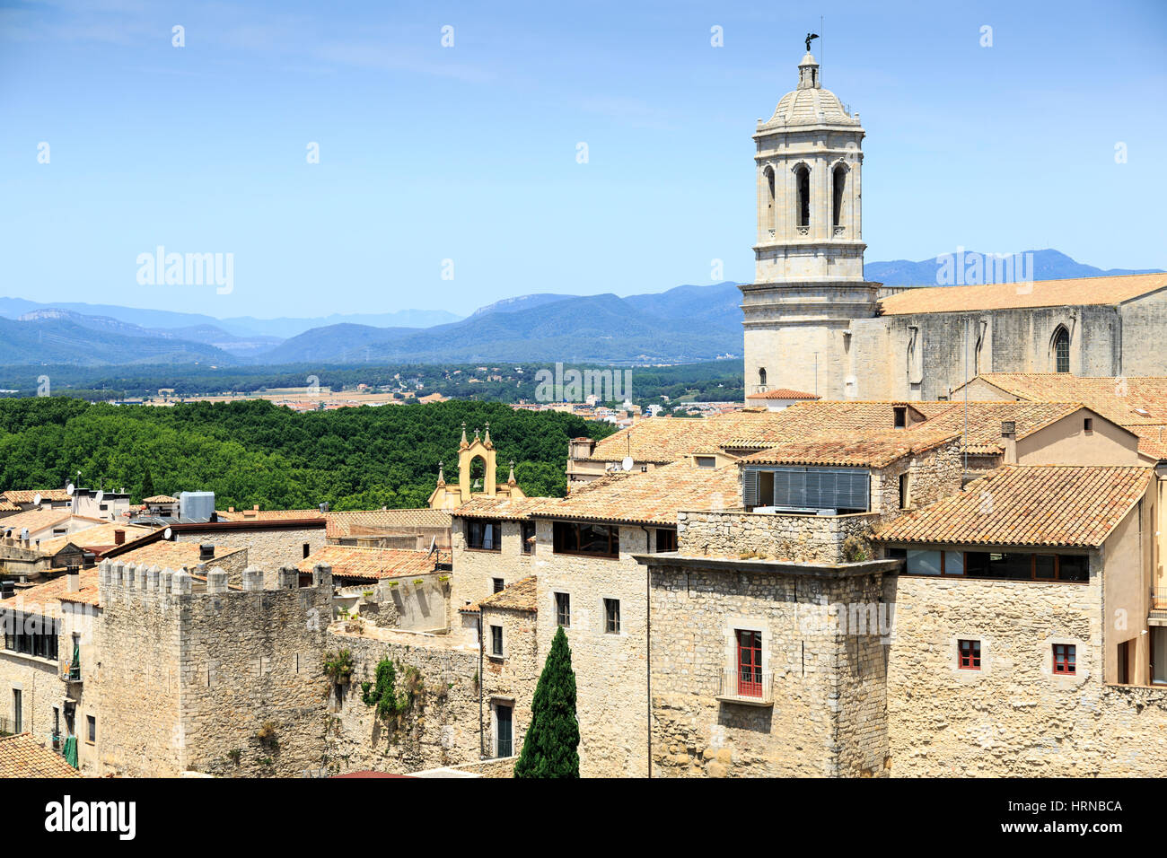 View of Barri Vell Old Quarter with mountains in the distance, Girona ...