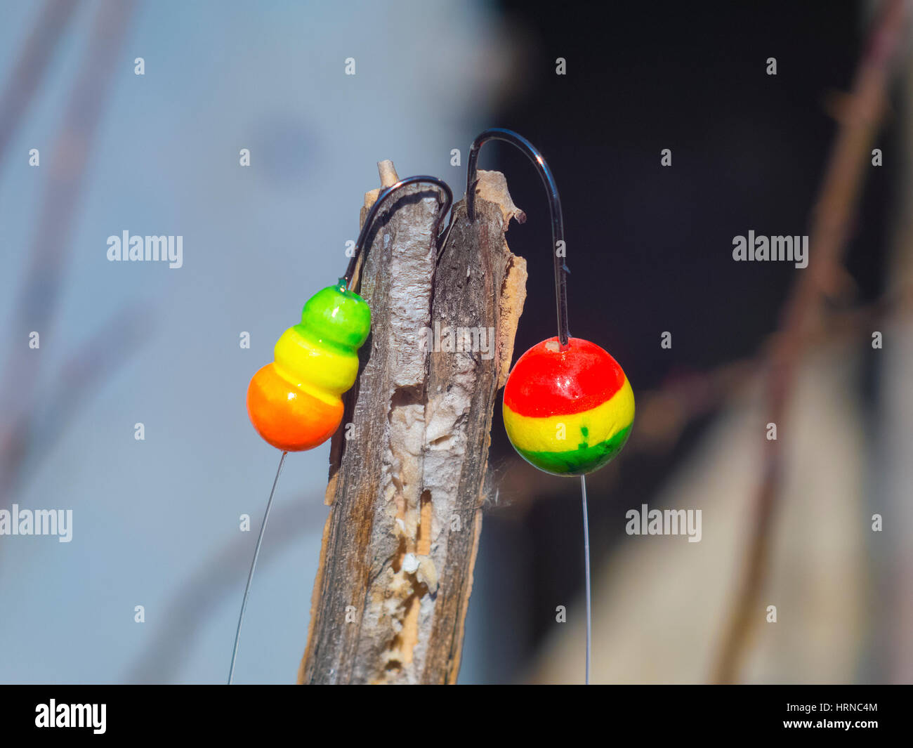 two colorful float with a hook for fishing closeup Stock Photo - Alamy