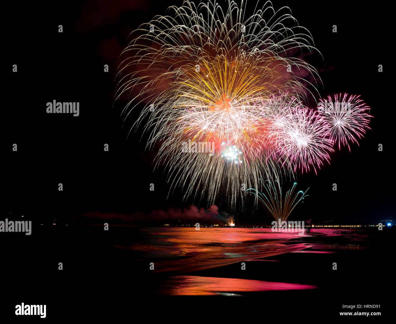 wonderful fireworks lighting ocean's water Stock Photo - Alamy