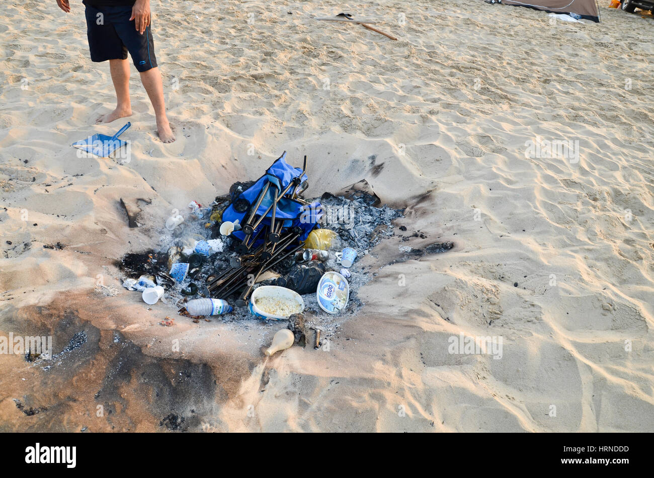 Litter left behind by the campers at a desert camp site Stock Photo - Alamy