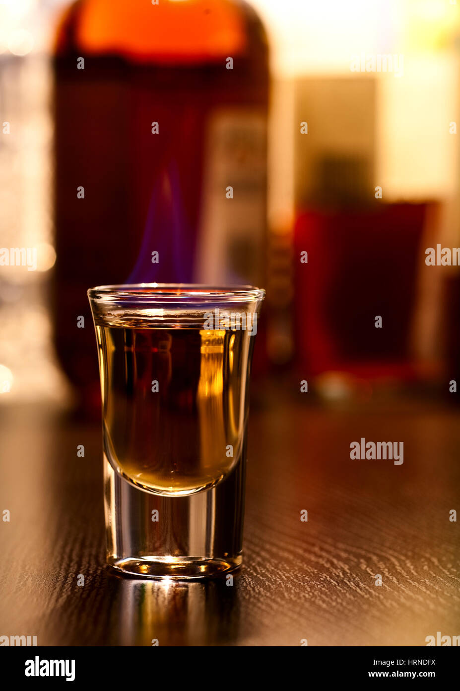 Burning cocktail in shot glass on a table, shallow focus Stock Photo ...