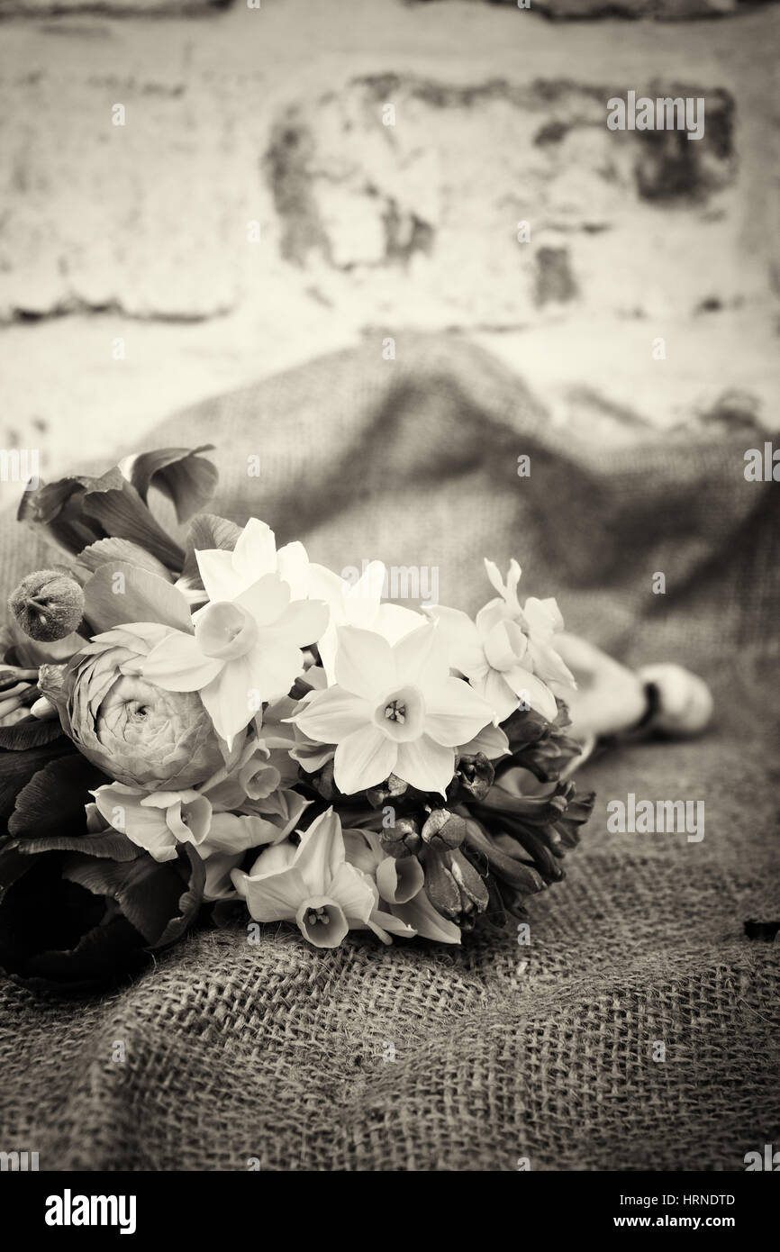Spring cut flower arrangement against a rustic background Stock Photo ...