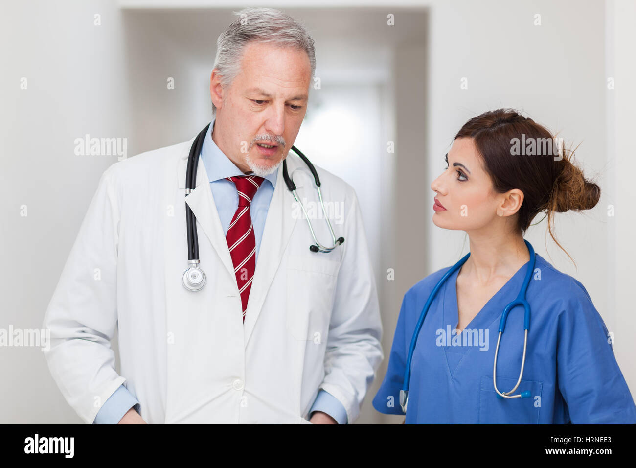 Doctor senior couple talk hi-res stock photography and images - Alamy