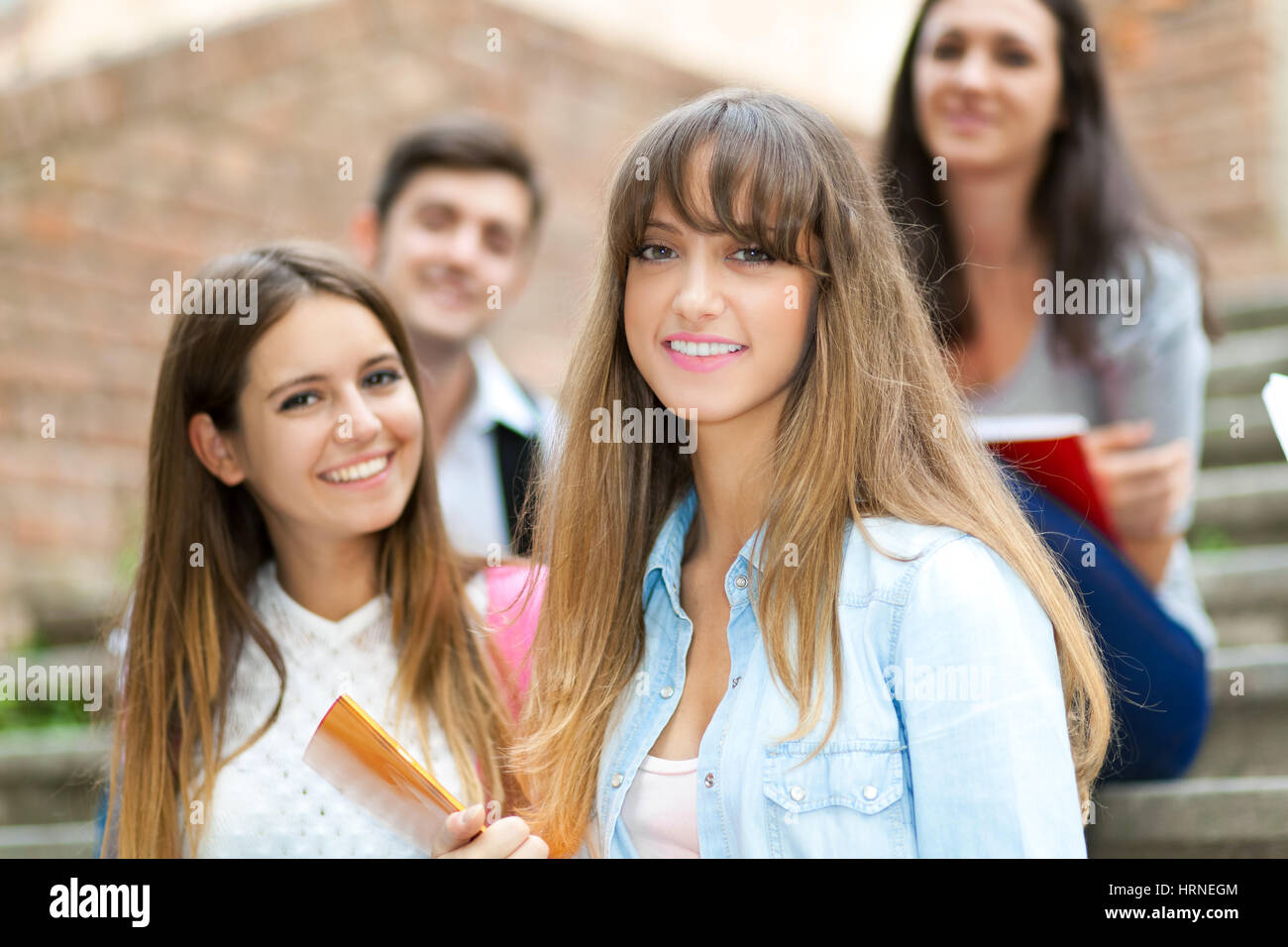Smiling students outdoor Stock Photo - Alamy