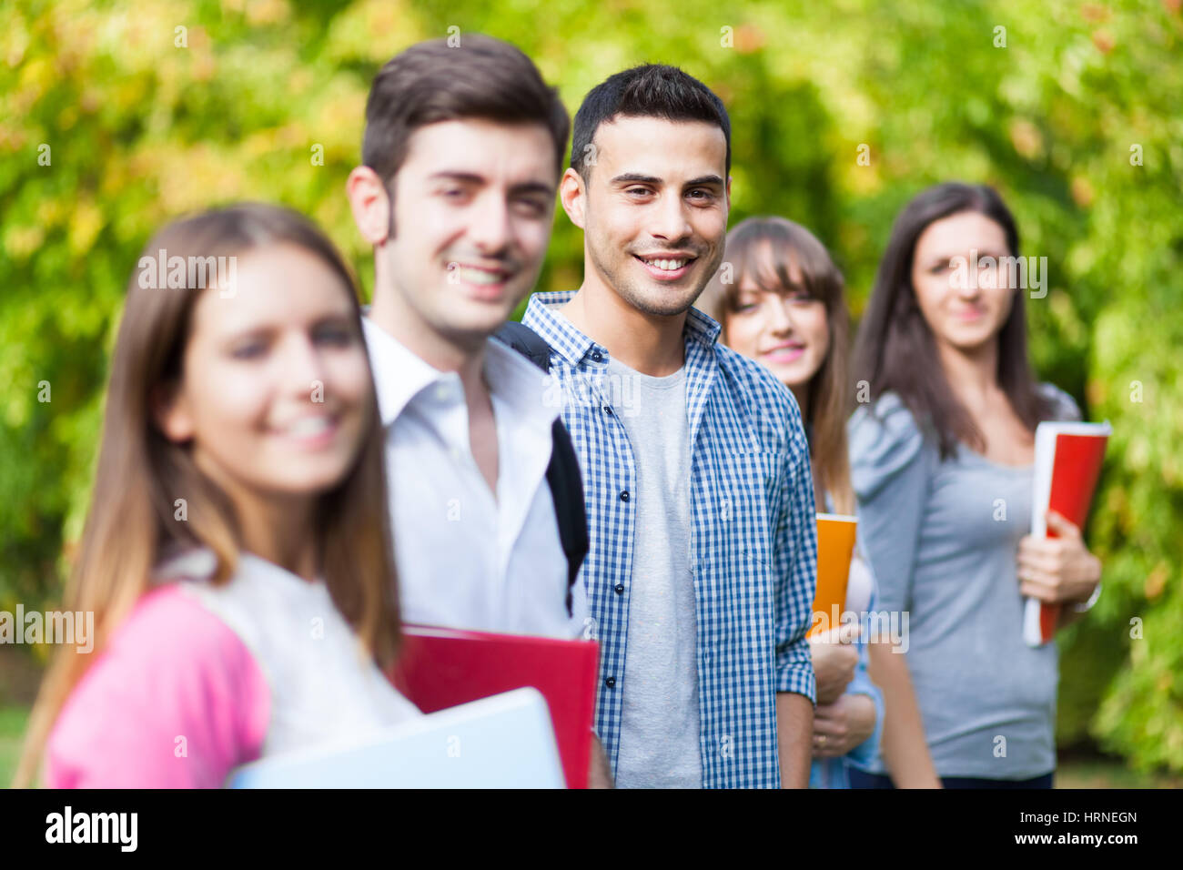 Group of students in a park Stock Photo - Alamy