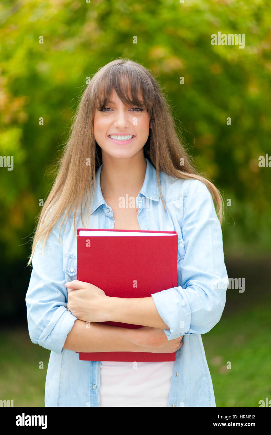 Smiling student outdoor Stock Photo - Alamy