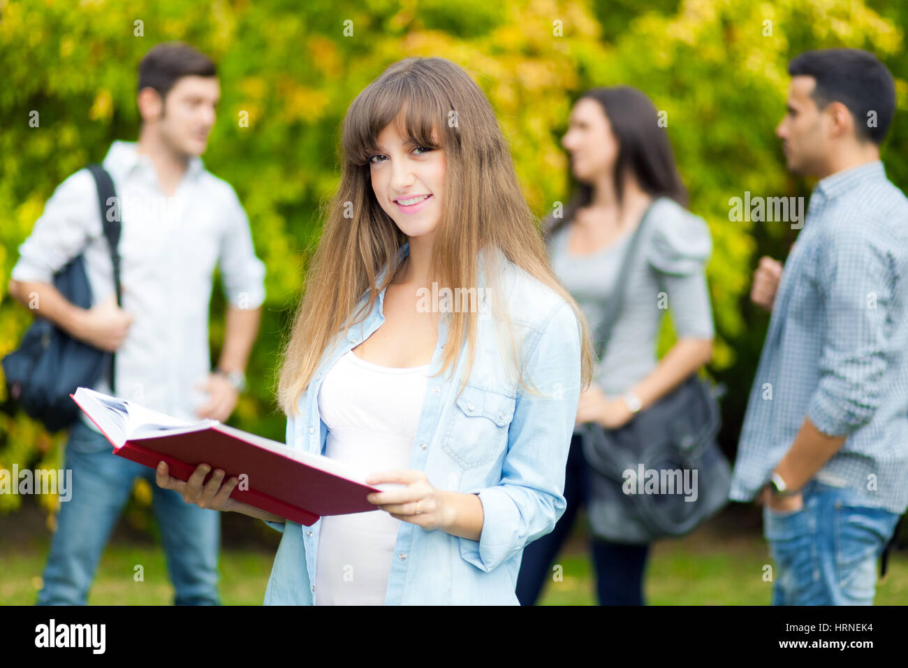 Students in a park Stock Photo - Alamy