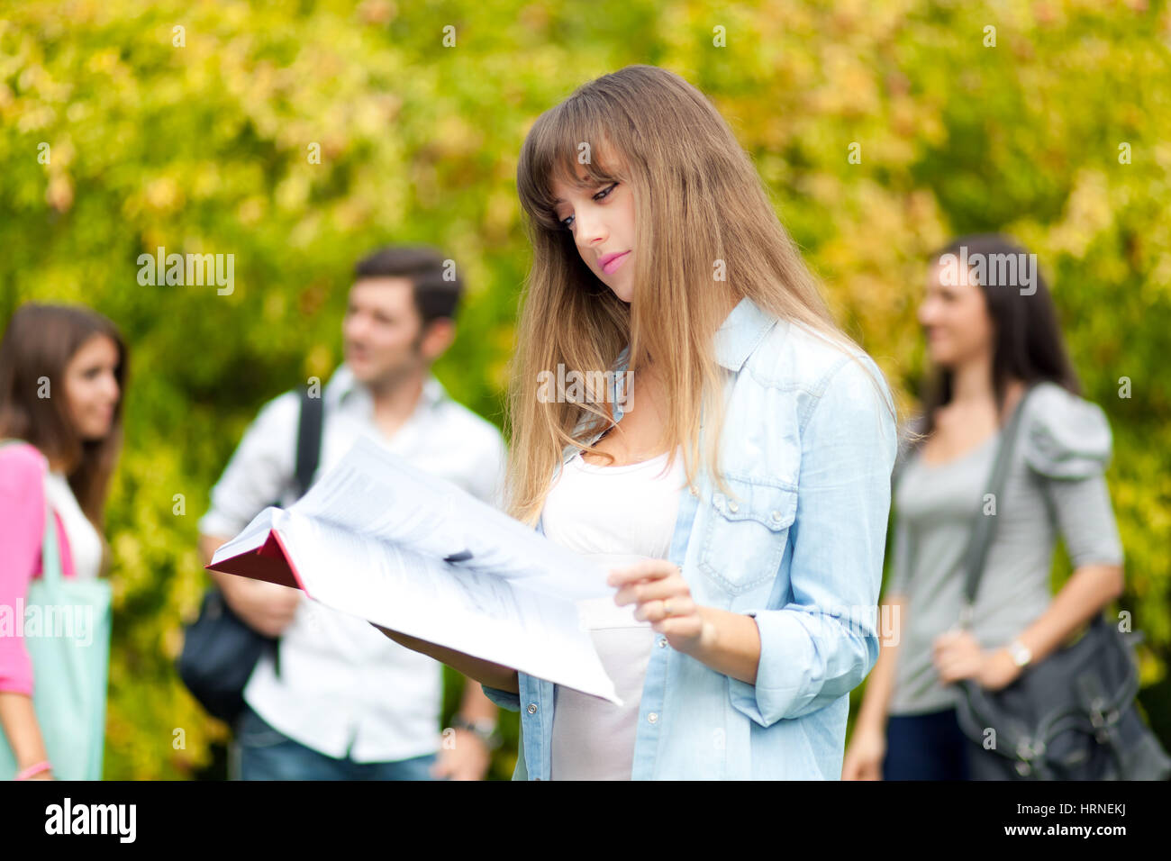 Students in a park Stock Photo - Alamy