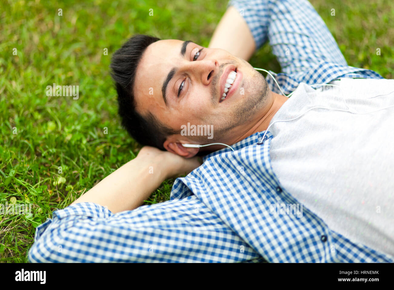 Young man sleeping grass hi-res stock photography and images - Alamy