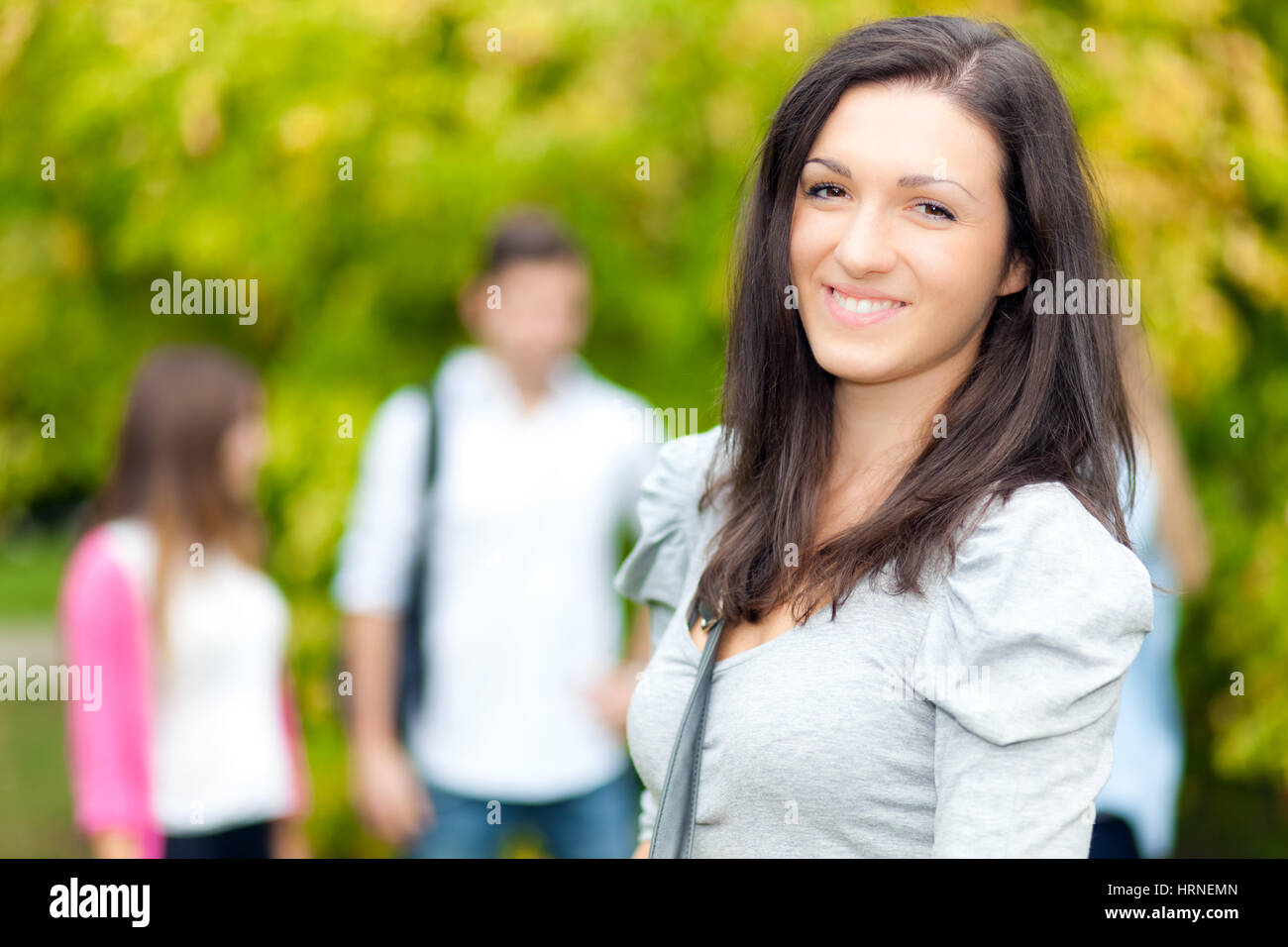 Students in a park Stock Photo - Alamy