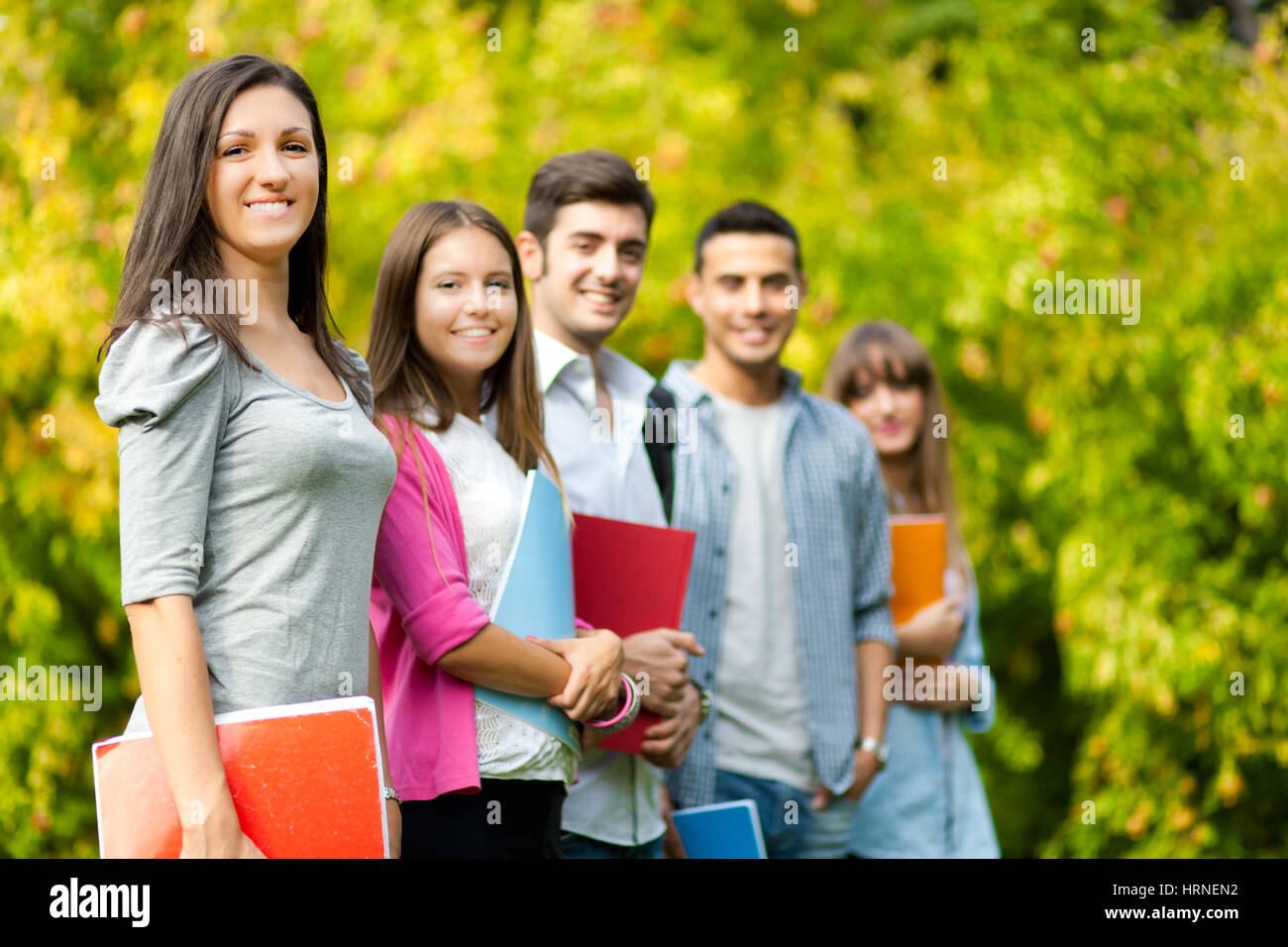 Smiling students at the park Stock Photo - Alamy