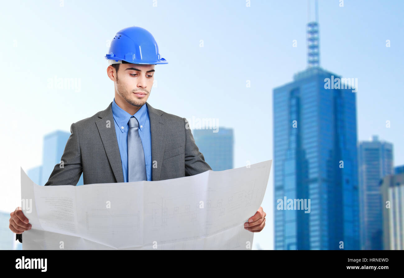 Portrait of a site manager reading a blueprint Stock Photo - Alamy