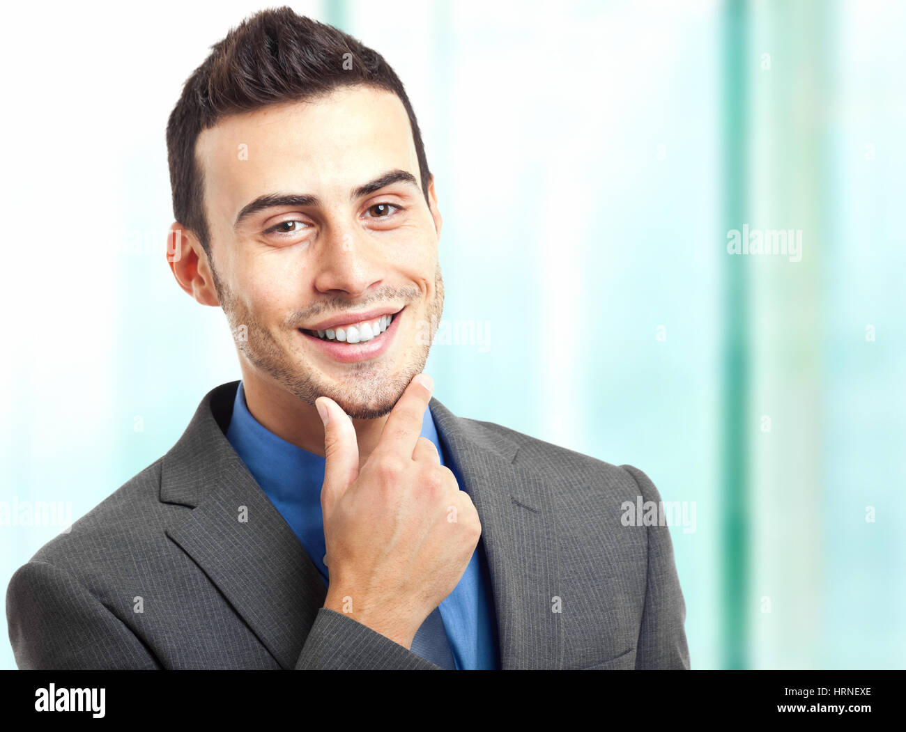 Friendly businessman portrait Stock Photo - Alamy
