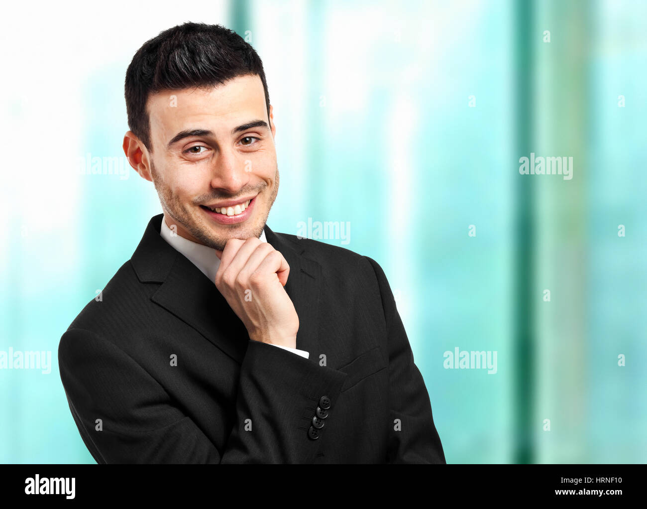 Confident young smiling manager Stock Photo - Alamy