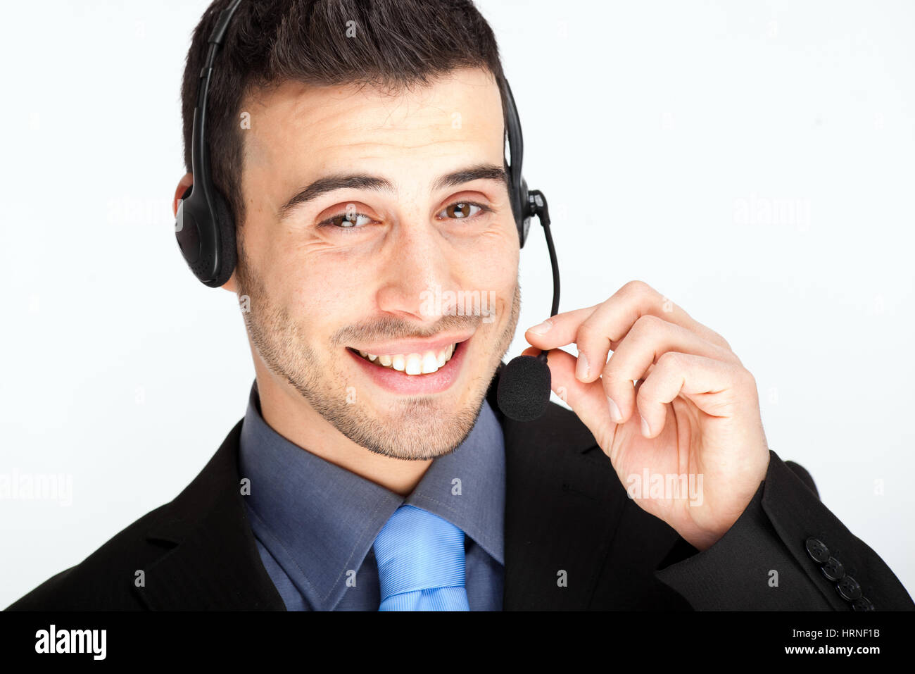 Portrait of a young happy call center operator Stock Photo - Alamy