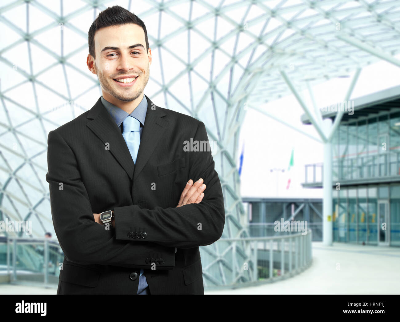 Friendly businessman in his office Stock Photo - Alamy