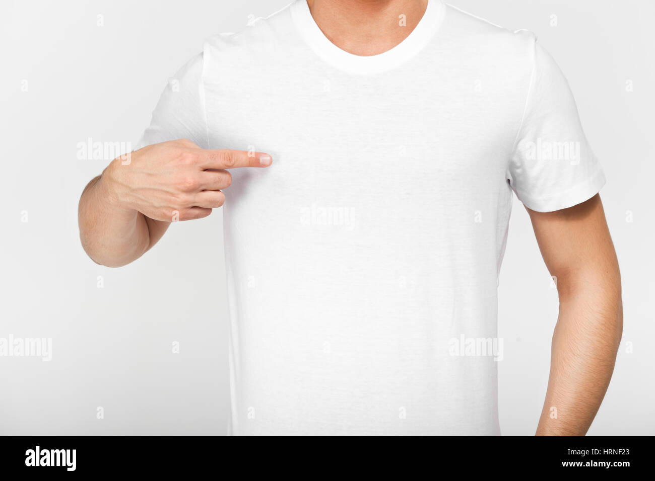 Man in blank t-shirt pointing his chest isolated on white Stock Photo ...