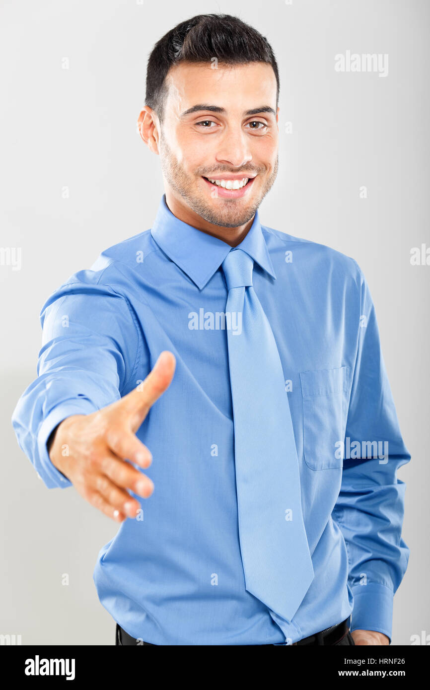 Businessman handshaking isolated on white Stock Photo - Alamy