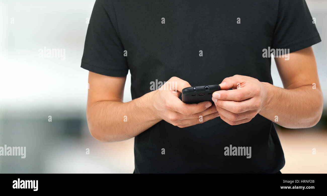 Man using is mobile phone Stock Photo - Alamy
