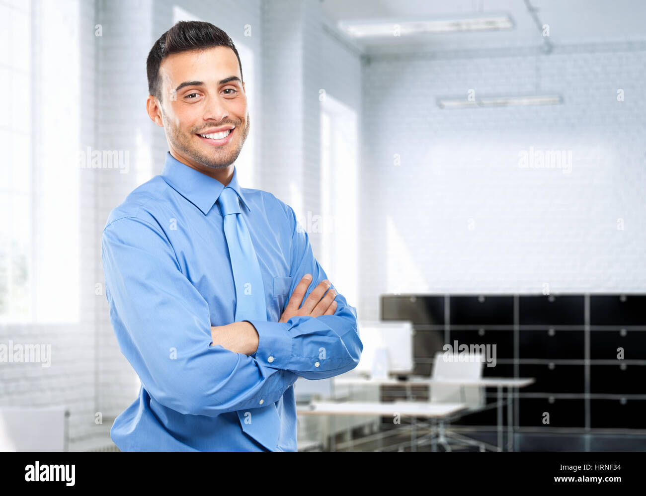 Handsome manager in his office Stock Photo - Alamy