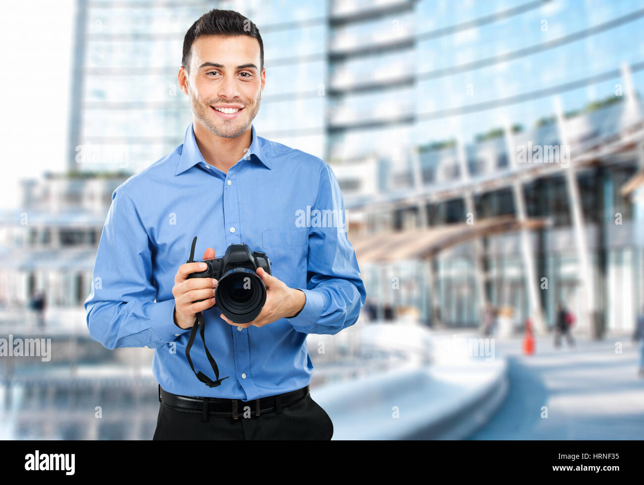 Photographer using his camera Stock Photo - Alamy