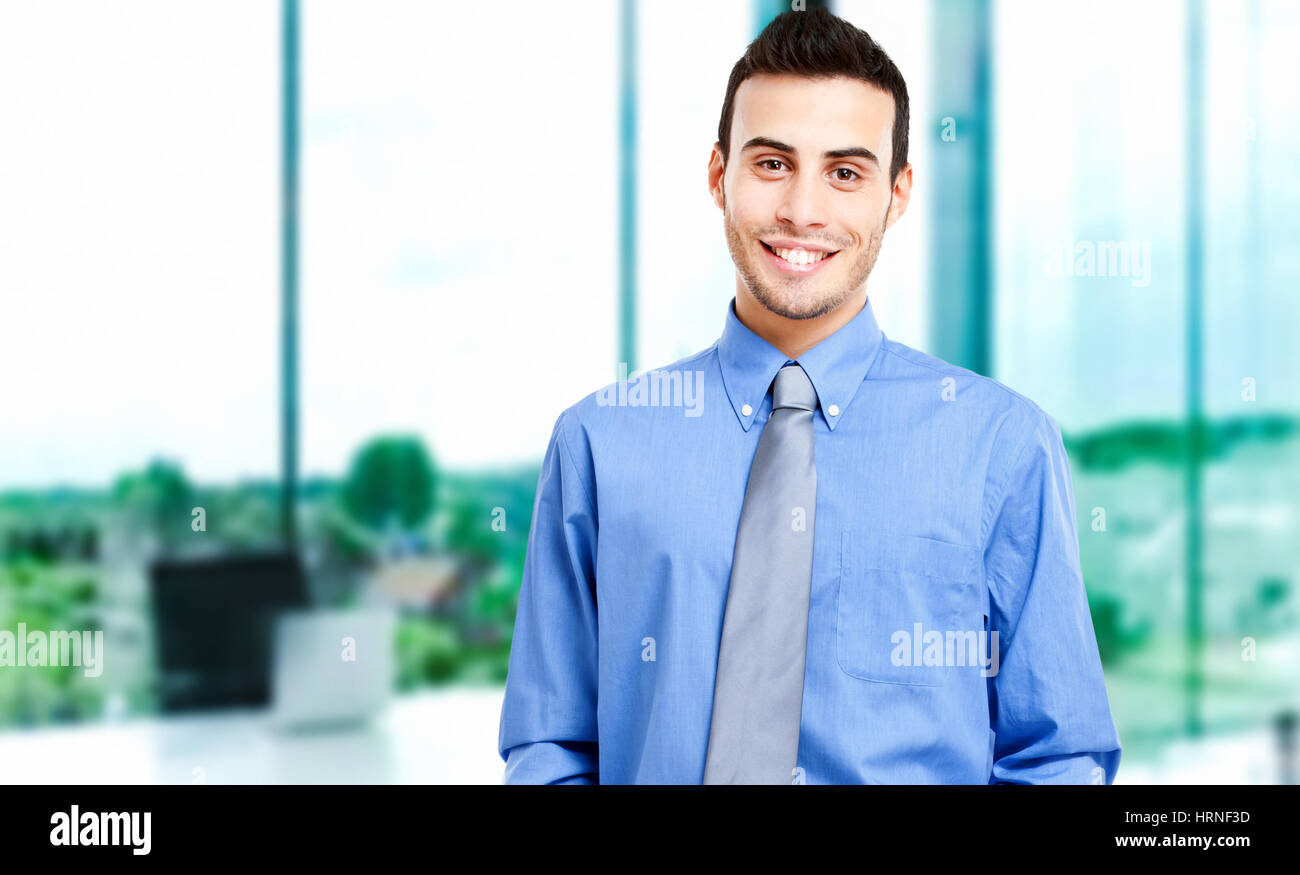 Young manager in his office Stock Photo - Alamy